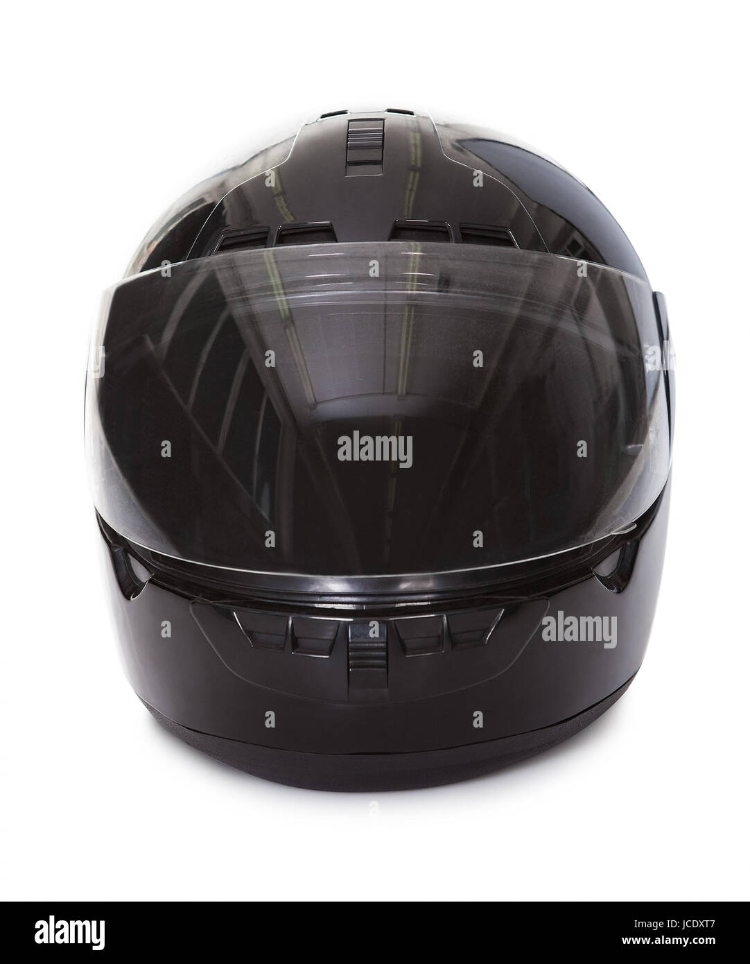 Studio image of a black motorcycle helmet with the visor closed on a ...