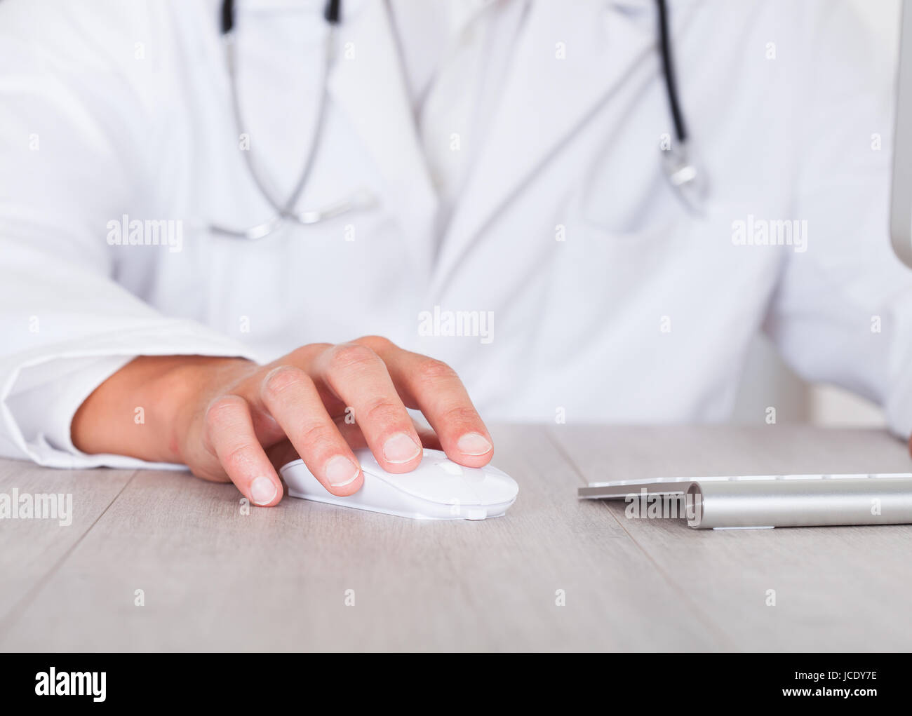 Close-up Of Male Doctor's Hand Using Computer Stock Photo - Alamy