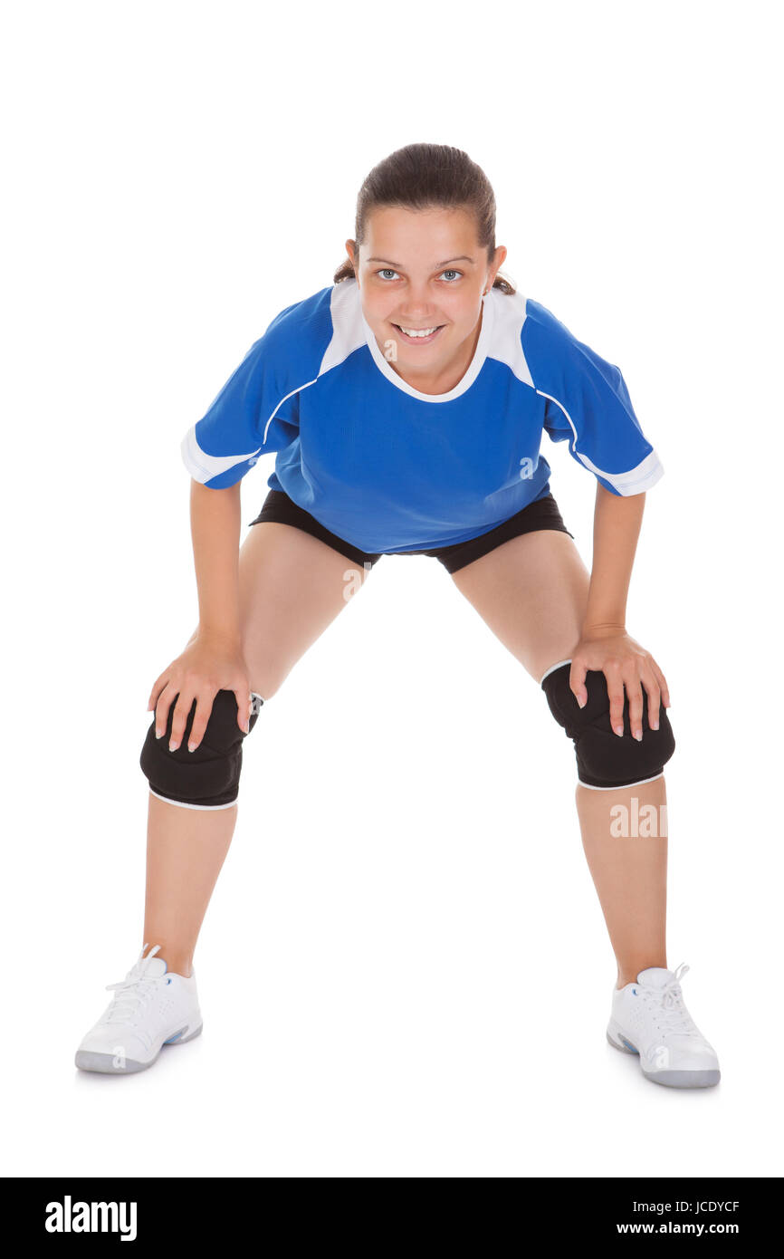 Portrait of a happy female Volleyball player over white background ...