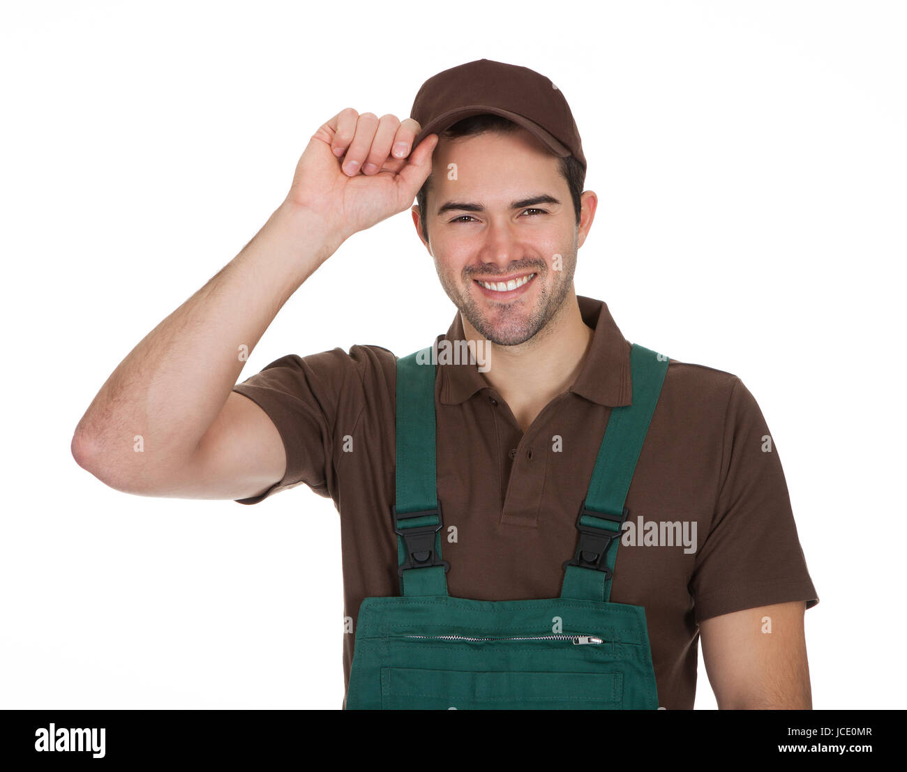 Happy young gardener in dungarees. Isolated on white Stock Photo - Alamy
