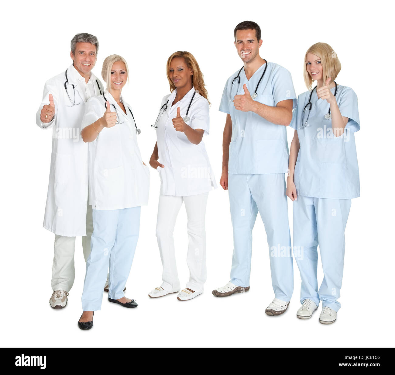 Group of happy doctors with thumbs up standing on white background ...