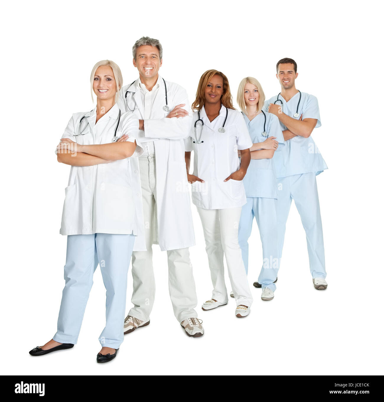 Portrait of diverse group of doctors standing isolated on white ...