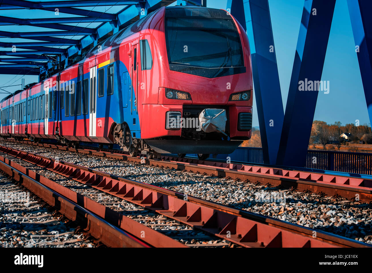 RedTrain goes over bridge Stock Photo - Alamy
