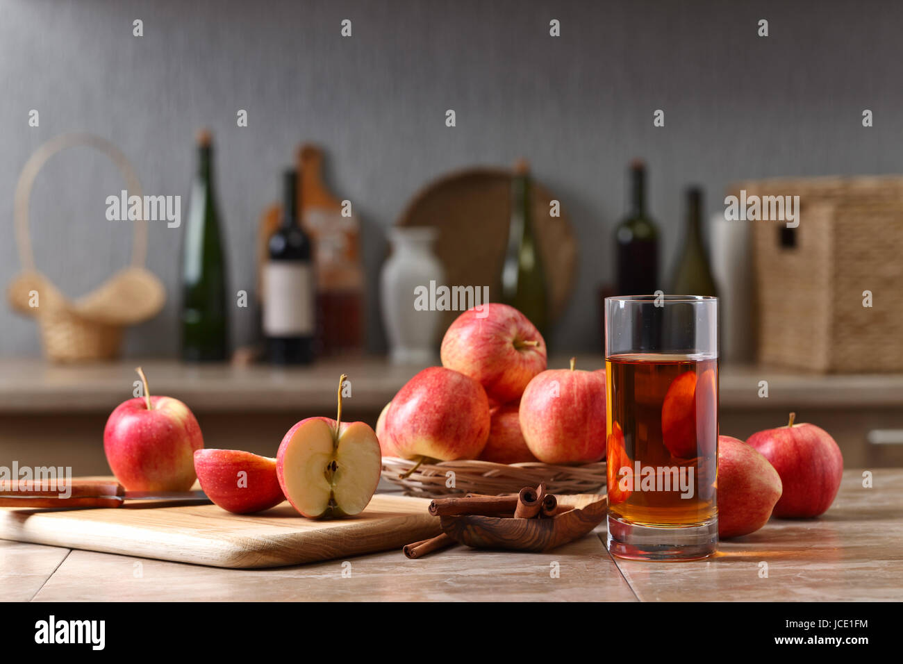 Glass of apple juice and ripe apples on a kitchen table Stock Photo - Alamy