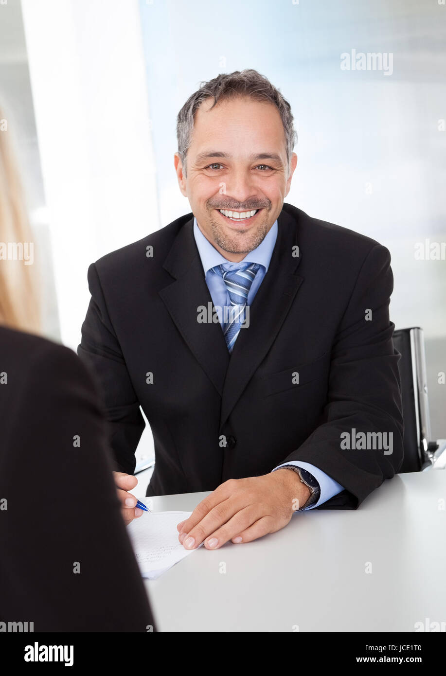 Portrait of successful businessman at the interview Stock Photo - Alamy