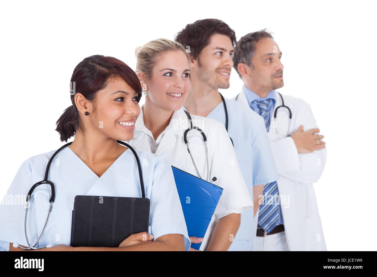 Group of doctors standing together isolated over white background Stock ...