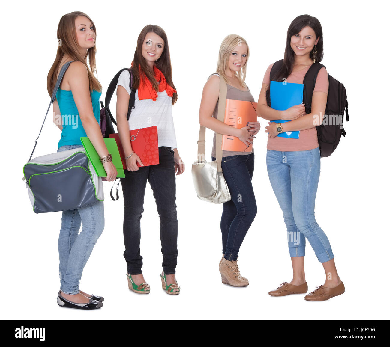 Studio shot of four female students isolated on white Stock Photo - Alamy