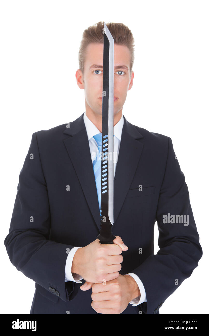 Young Businessman Standing With Sword Over White Background Stock Photo ...