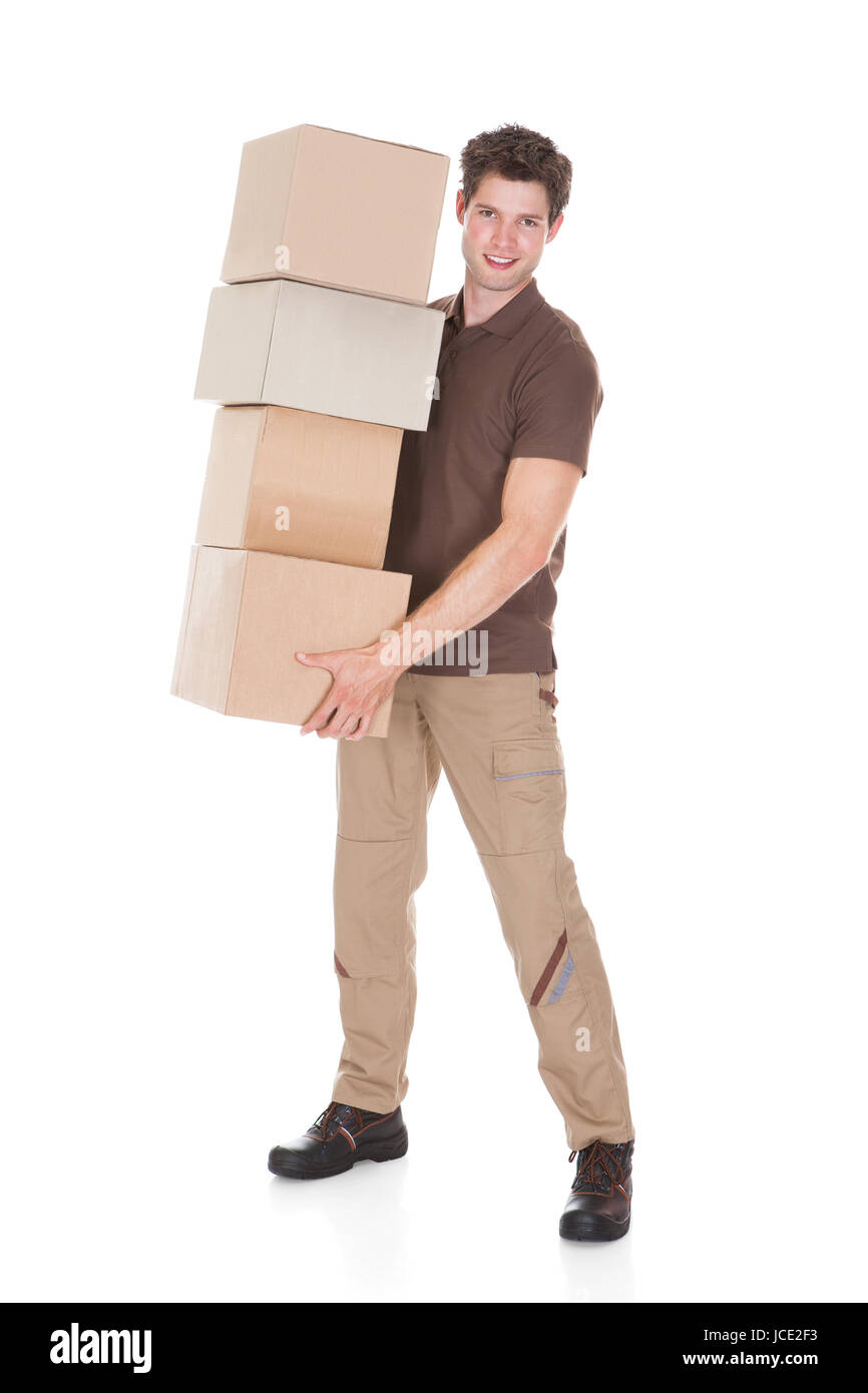 Portrait Of Young Happy Man Carrying Stack Of Boxes Stock Photo - Alamy
