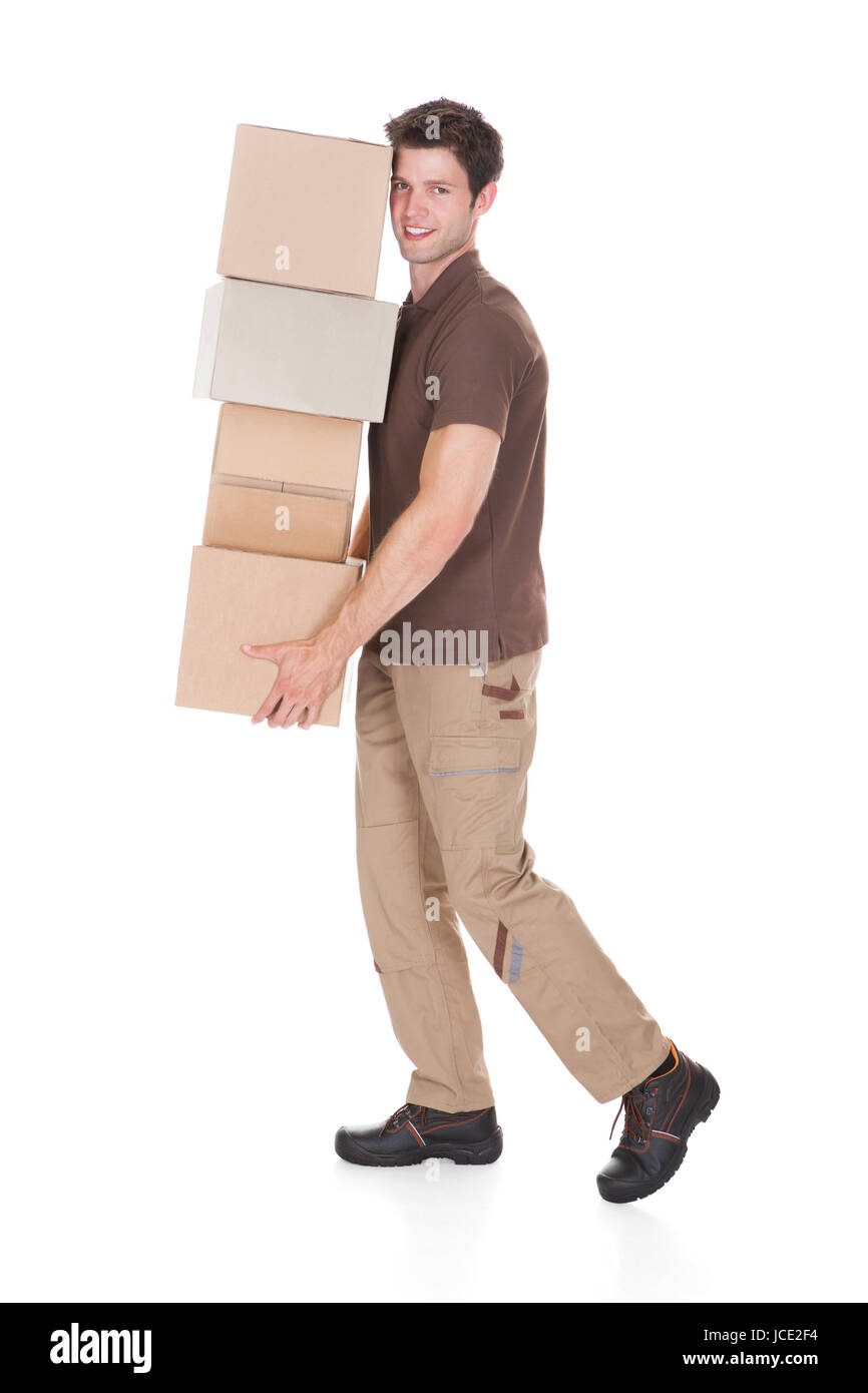 Portrait Of Young Happy Man Carrying Stack Of Boxes Stock Photo - Alamy