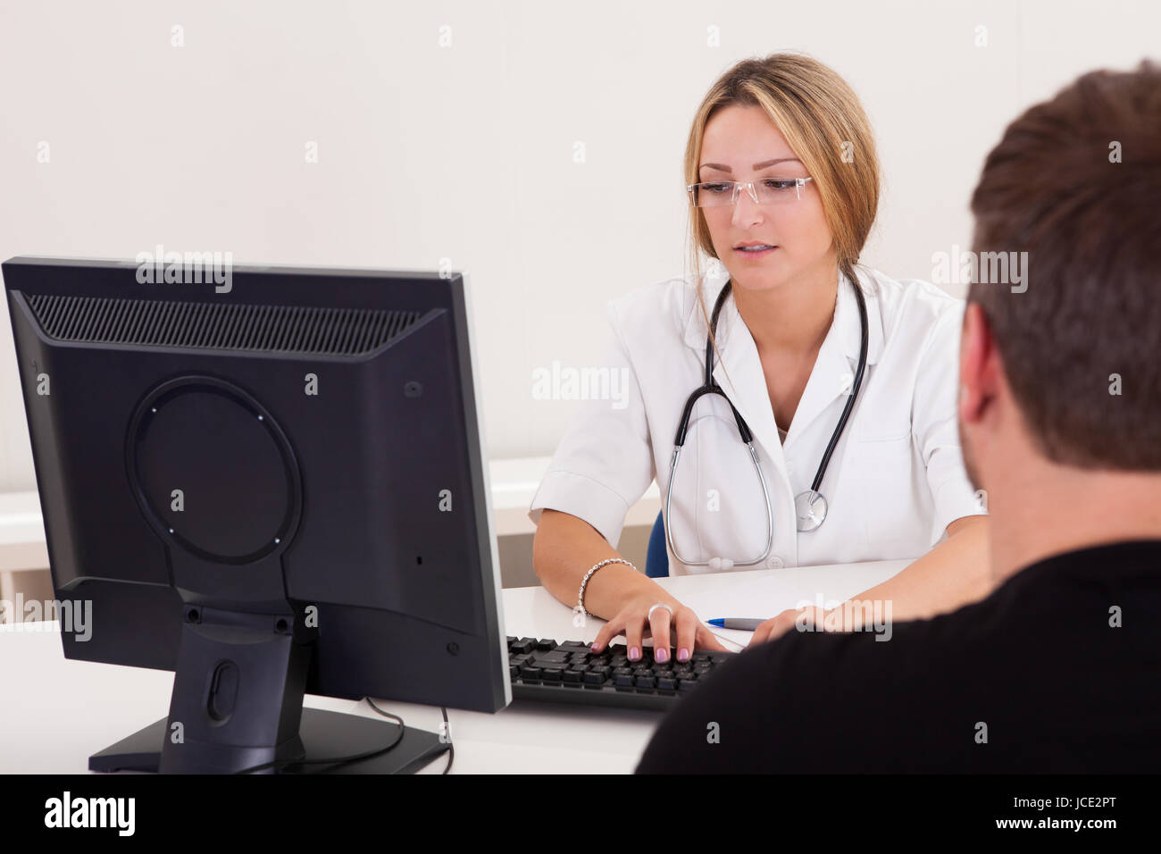 Physician explains the procedure before doing this to him Stock Photo ...