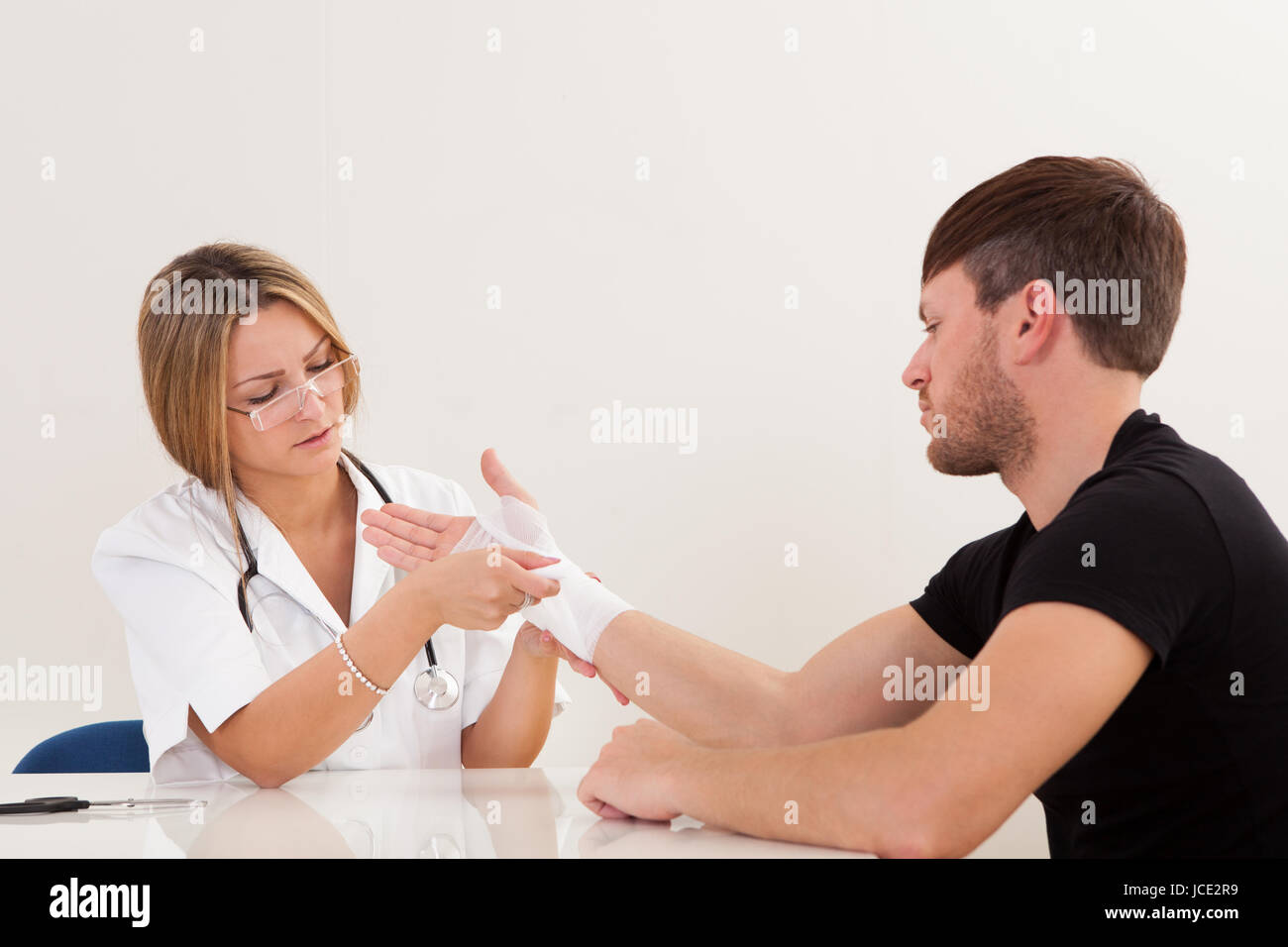 Sprained right hand treated by trained person Stock Photo - Alamy
