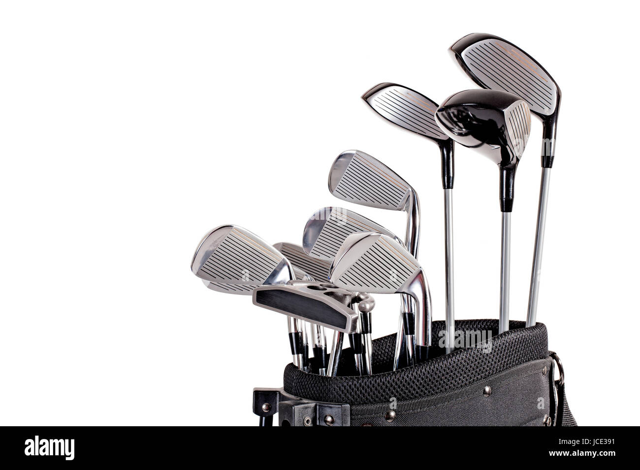 set of metal golf clubs in bag up close isolated on white background ...