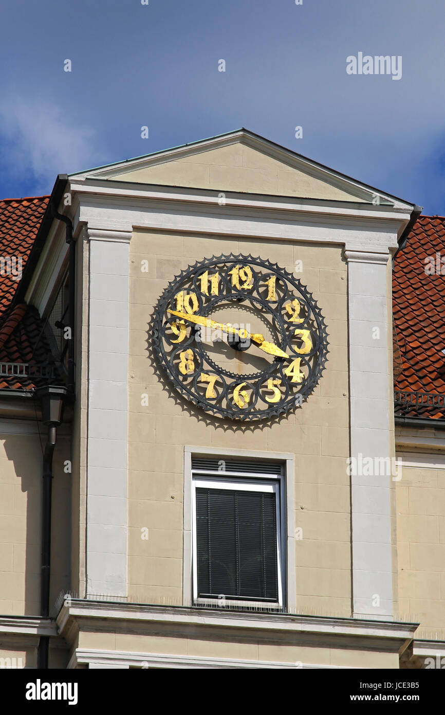 Clock with golden numbers at building Stock Photo - Alamy