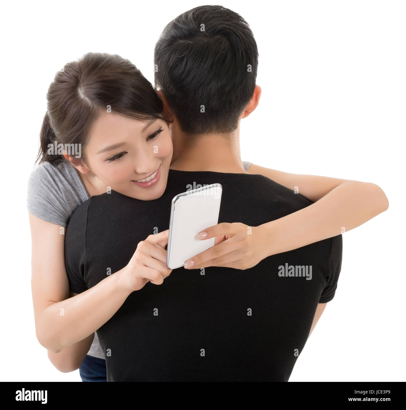 Asian woman hug her boyfriend and use the cellphone Stock Photo - Alamy