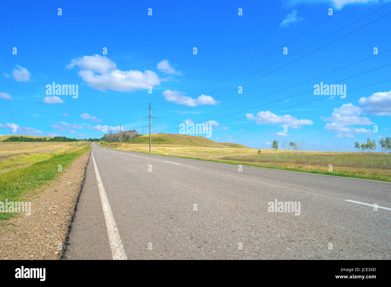 Summer landscape with main road, blue sky and clouds Stock Photo - Alamy