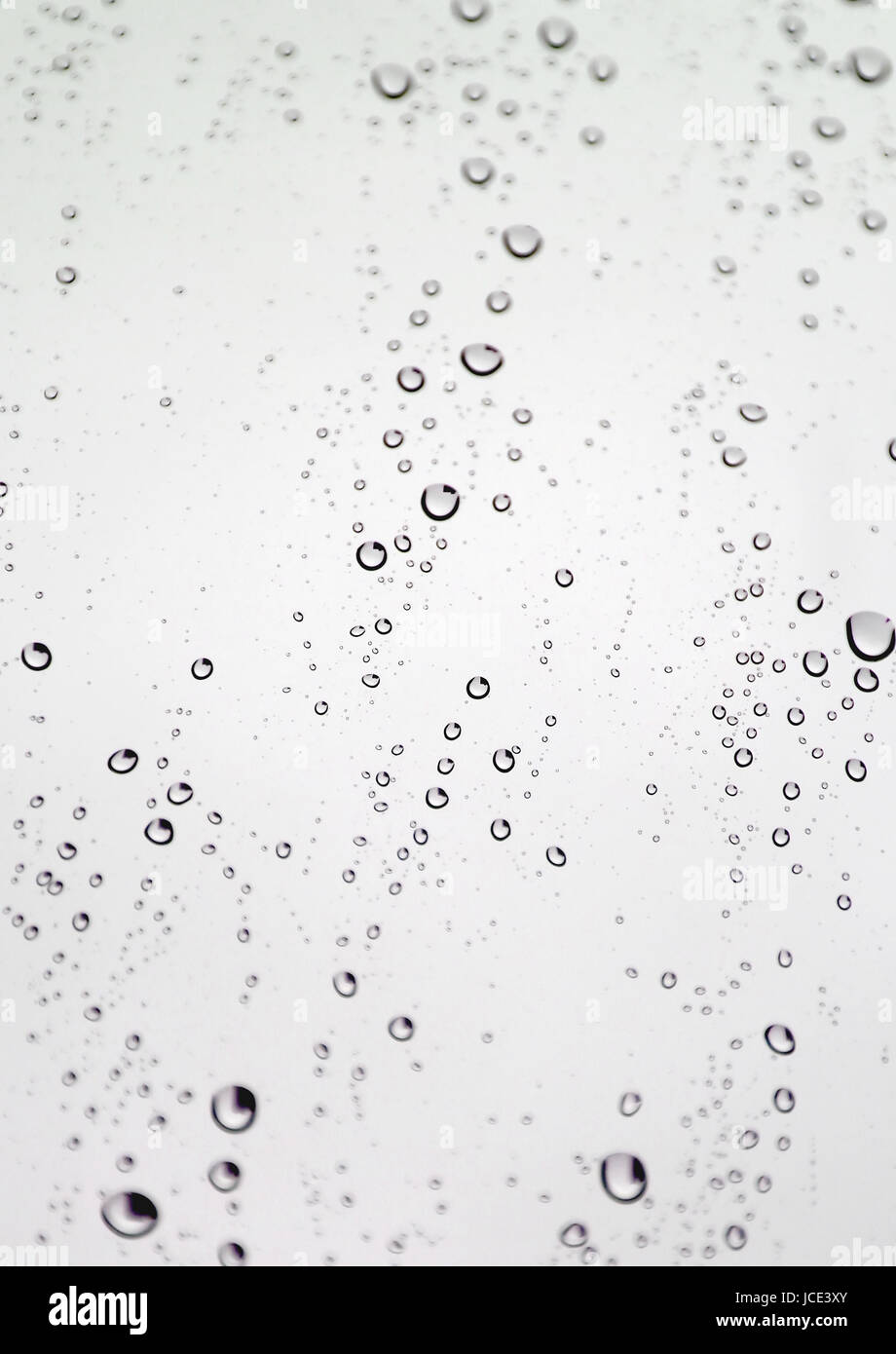 Drops of rain on the inclined window (glass). Shallow DOF Stock Photo ...