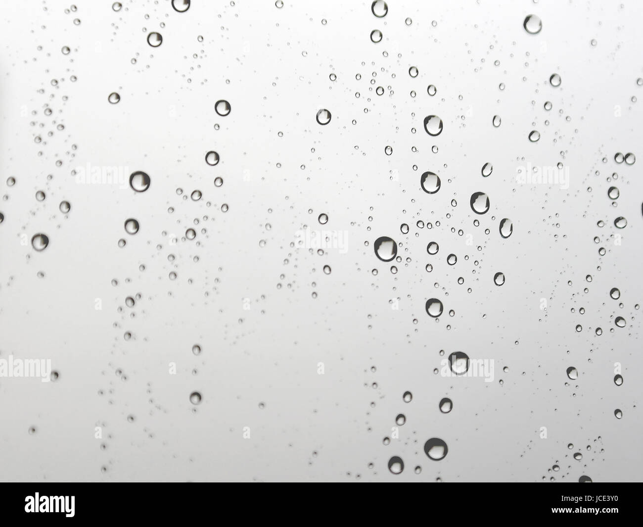 Drops of rain on the inclined window (glass). Shallow DOF Stock Photo ...