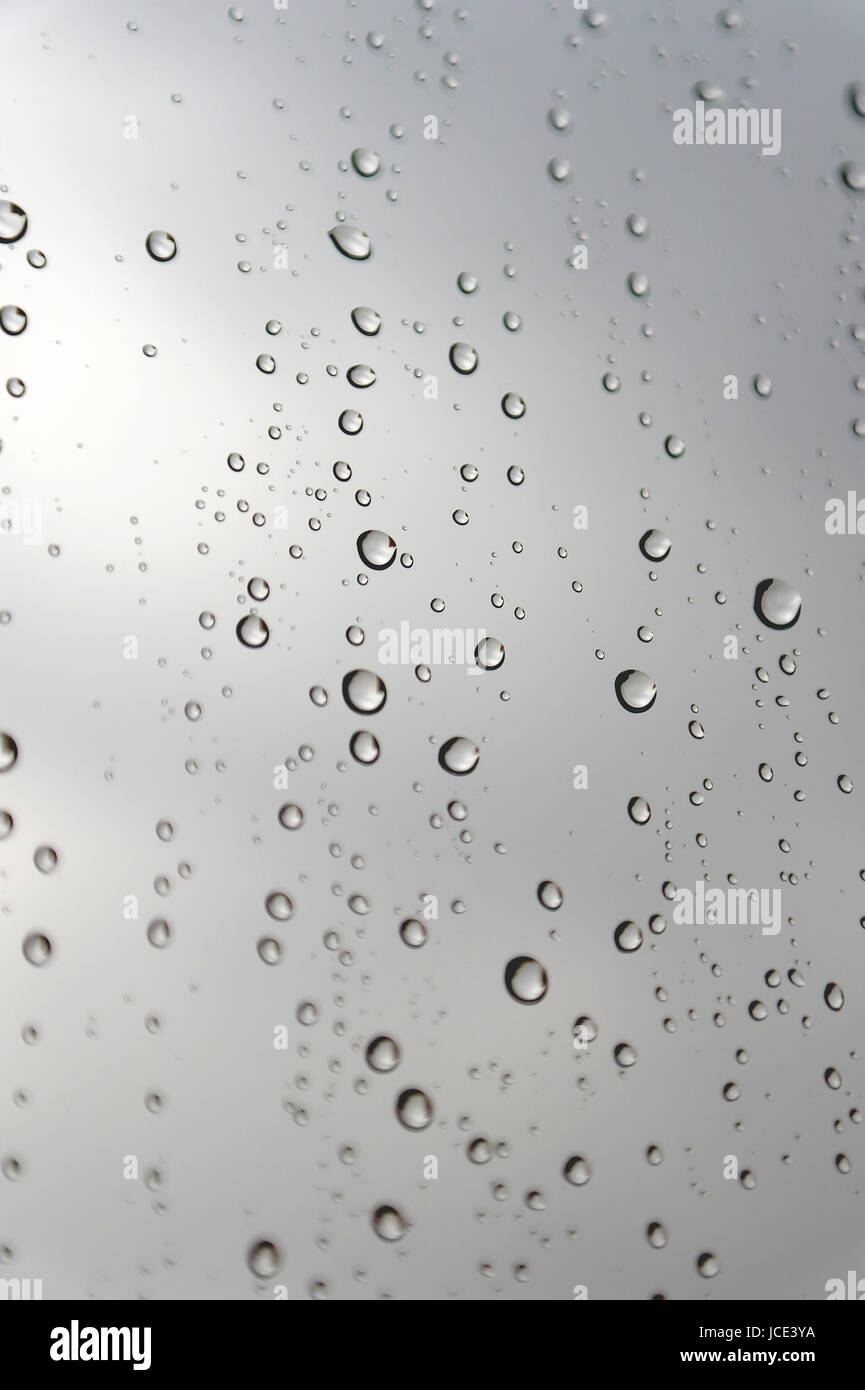 Drops of rain on the inclined window (glass). Shallow DOF Stock Photo ...