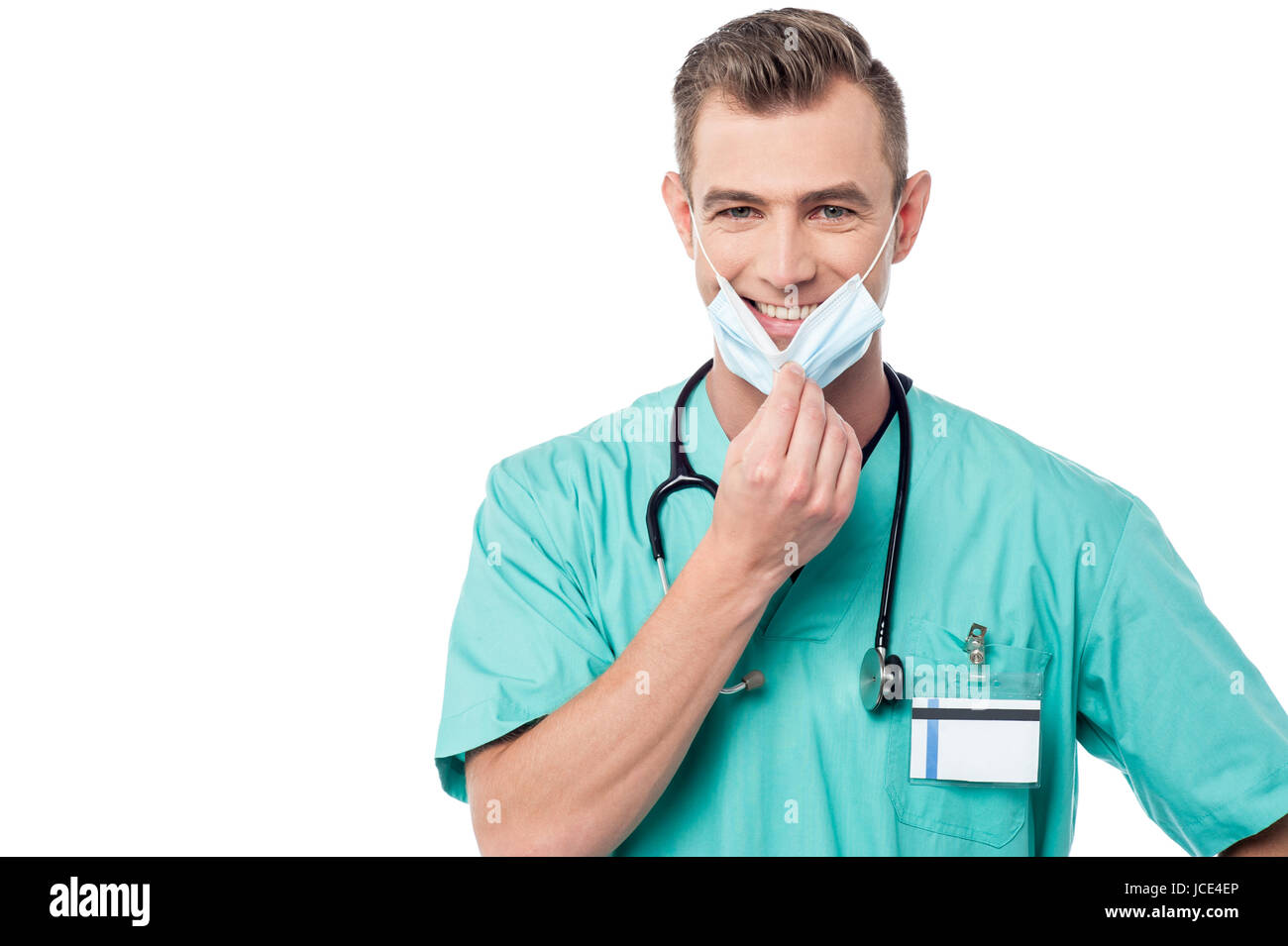 Male doctor removing his surgical mask Stock Photo - Alamy