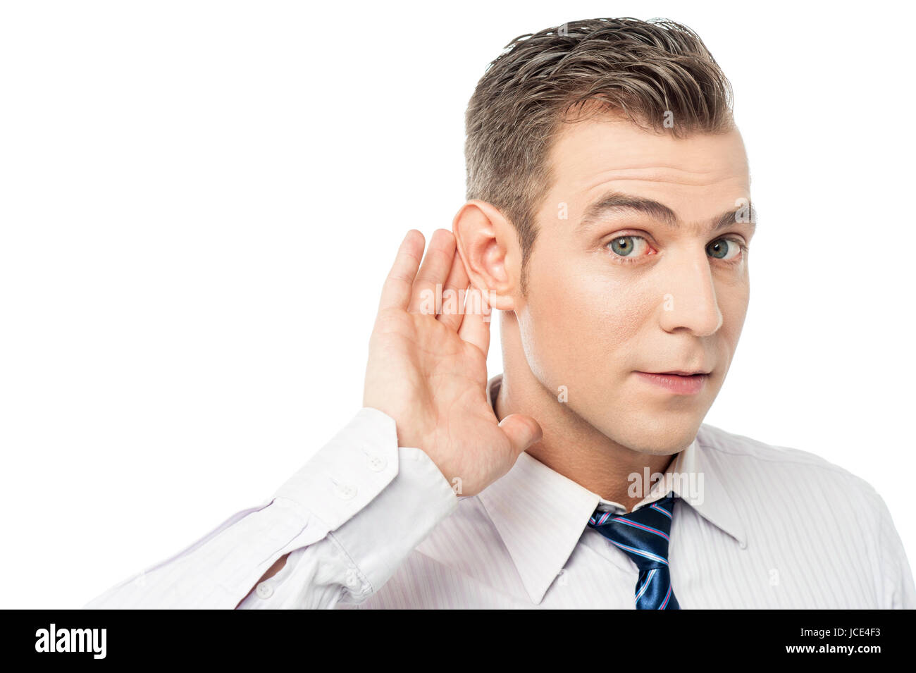 Business executive listening closely to something Stock Photo - Alamy