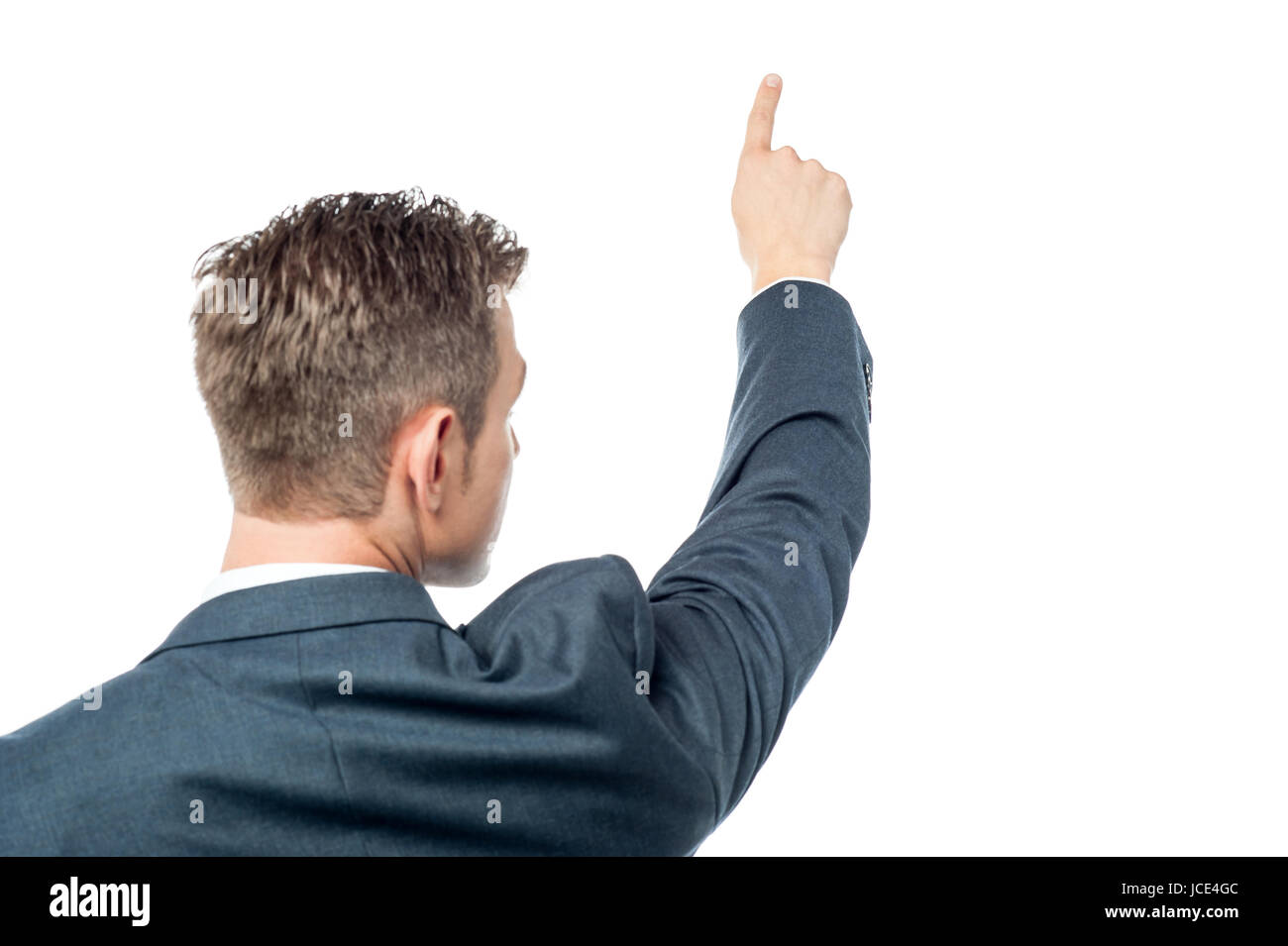 Back view of a businessman pointing upwards over on white Stock Photo ...