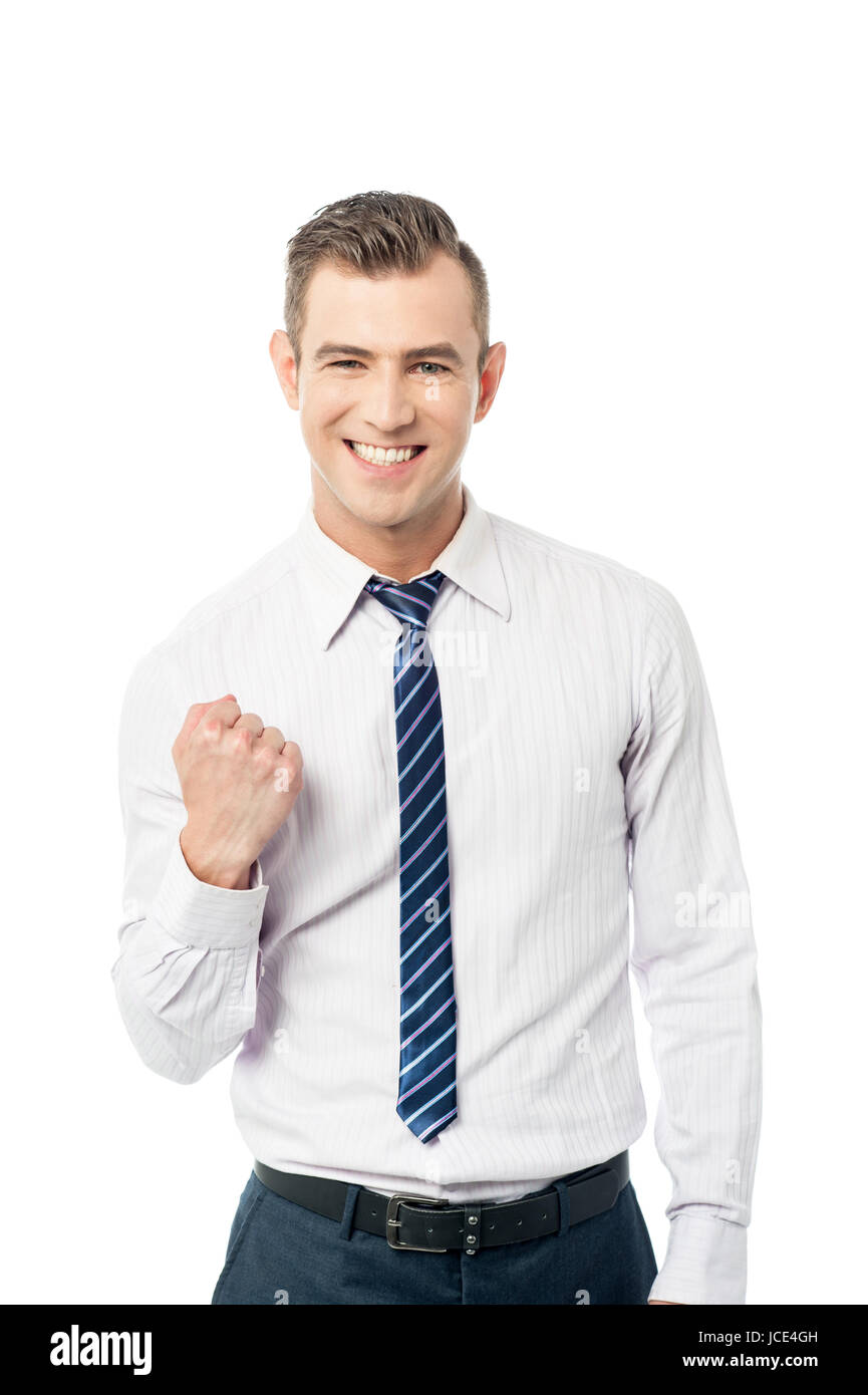 Young male executive celebrating his success Stock Photo - Alamy