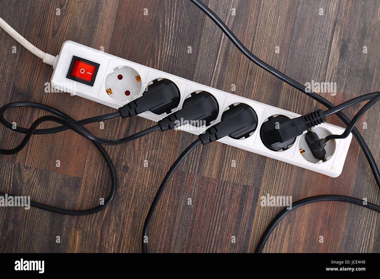 Plugged in electric devices in an extension cord Stock Photo - Alamy