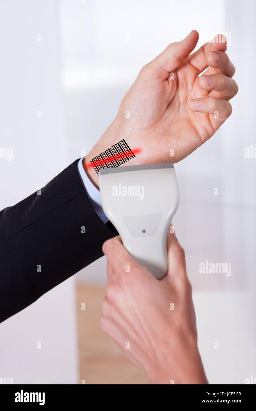 Scanning barcode on the hand using scanner Stock Photo - Alamy