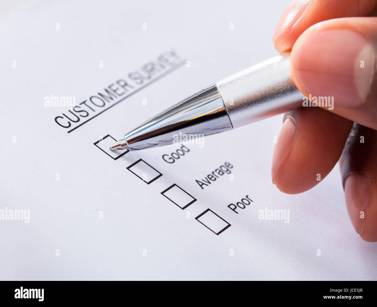 Close-up Of Human Hand Filling Customer Survey Form Stock Photo - Alamy