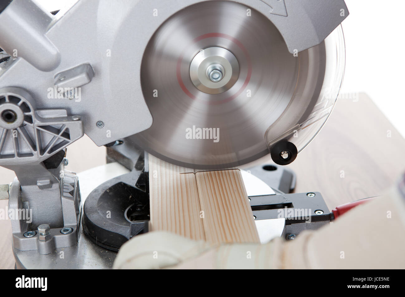 Worker cutting timber using circular electric saw Stock Photo - Alamy