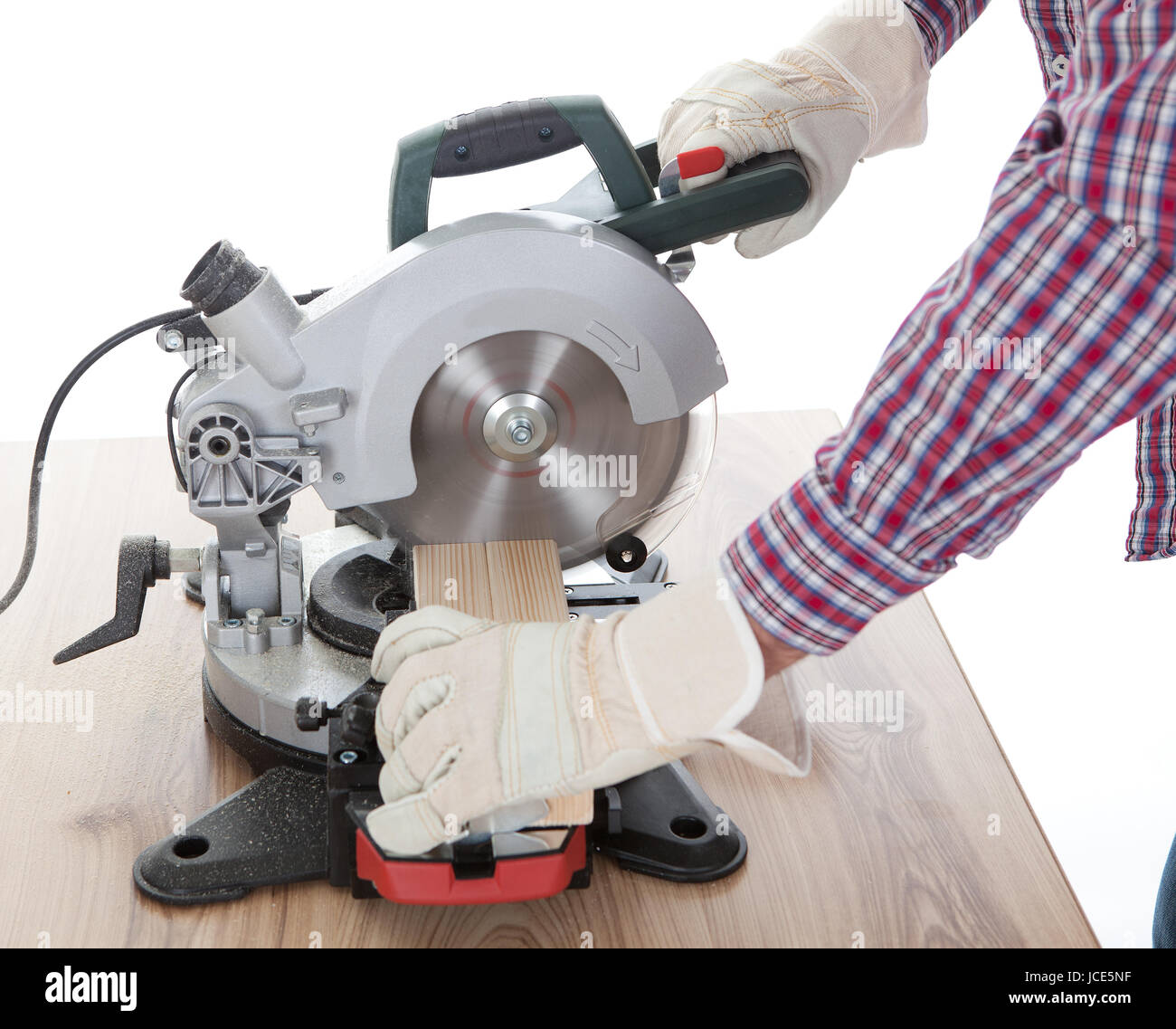 Worker cutting timber using circular electric saw Stock Photo - Alamy