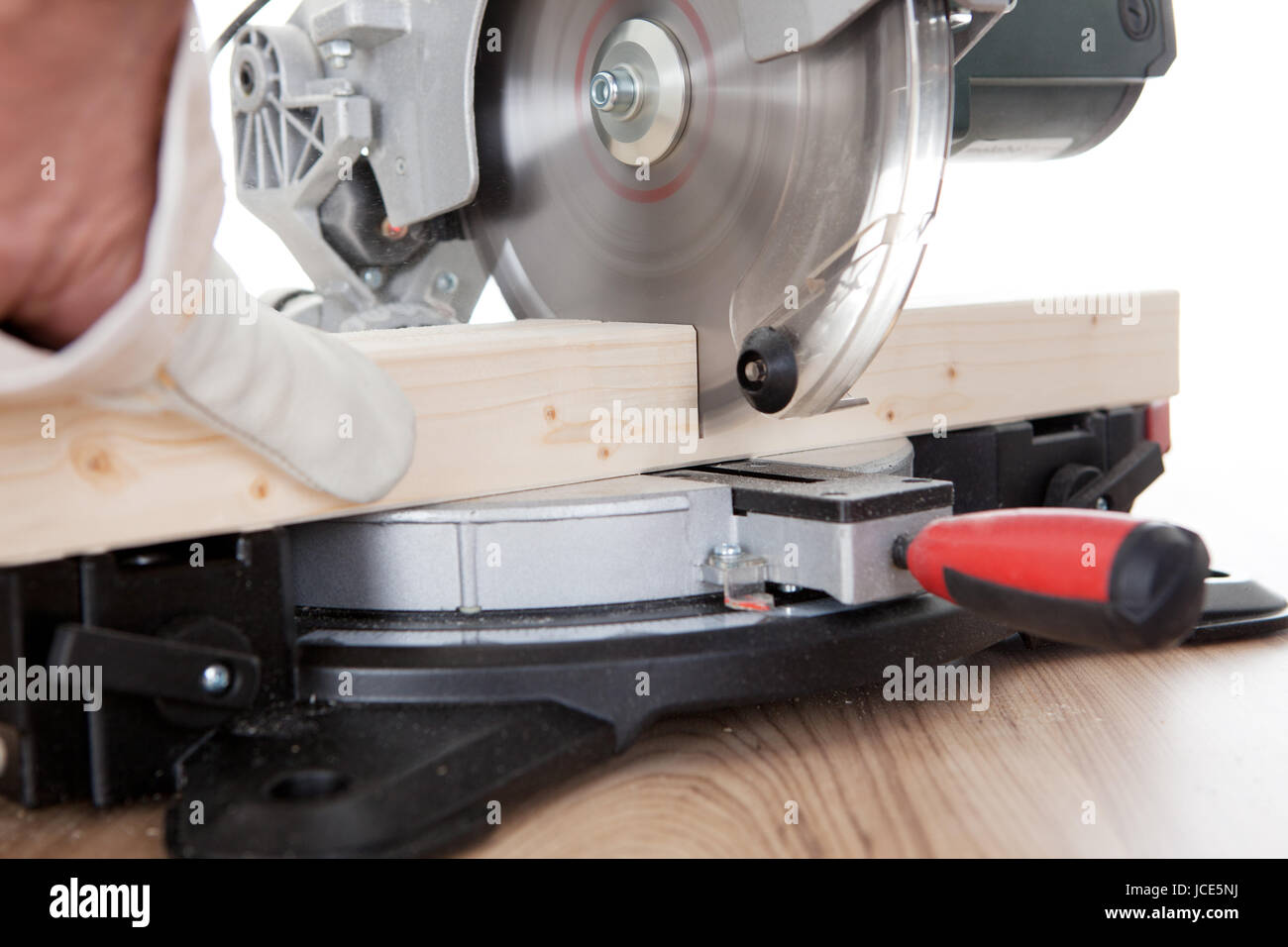Worker cutting timber using circular electric saw Stock Photo - Alamy