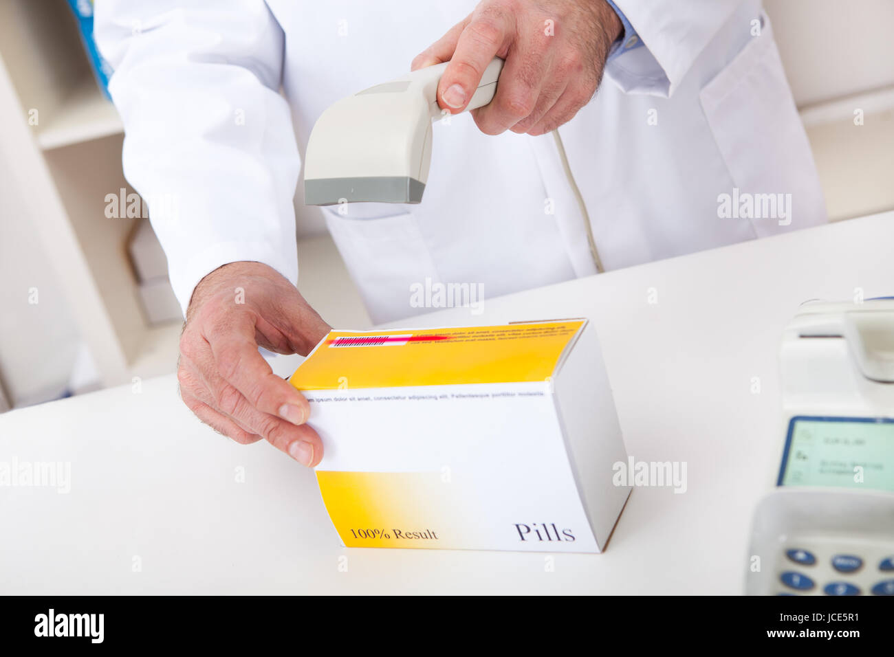 Pharmacist scanning barcode using scanner at drugstore Stock Photo - Alamy