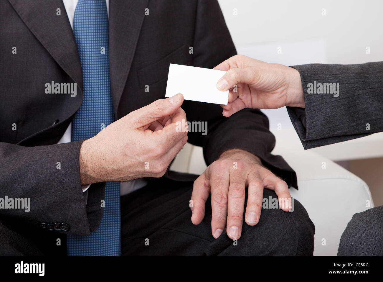 Two business people exchanging visiting card at the meeting Stock Photo ...