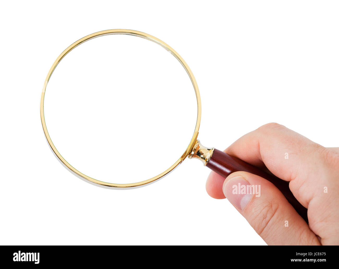 Close-up of hand looking through magnifying glass over white background ...