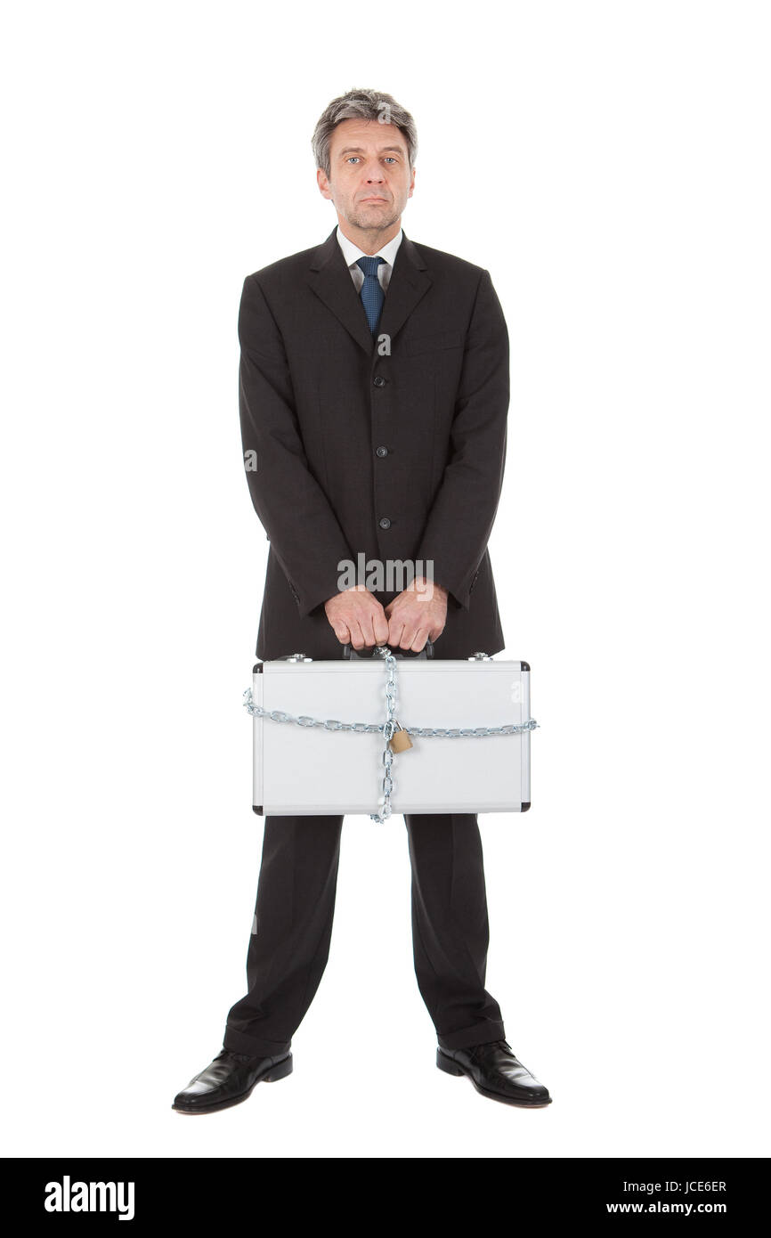 Businessman holding metal suitcase with chain and lock. Isolated on ...