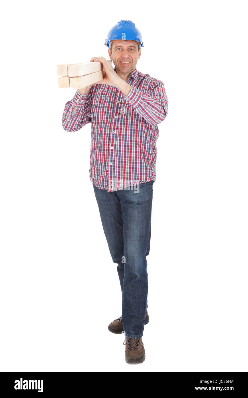 Portrait of builder carrying timber. Isolated on white Stock Photo - Alamy