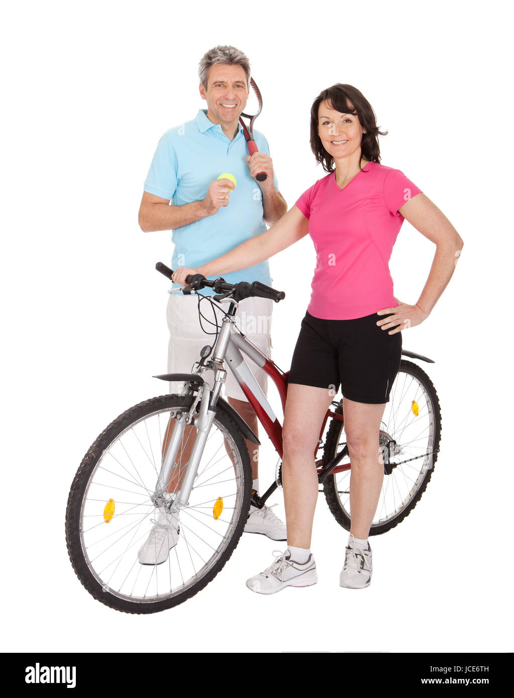 Mature active couple doing sports. Isolated on white Stock Photo - Alamy