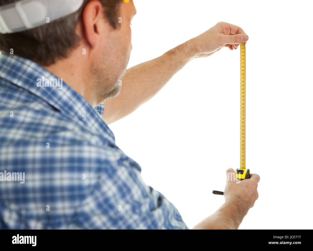 Confident worker using tape to measure dimensions. Isolated on white ...
