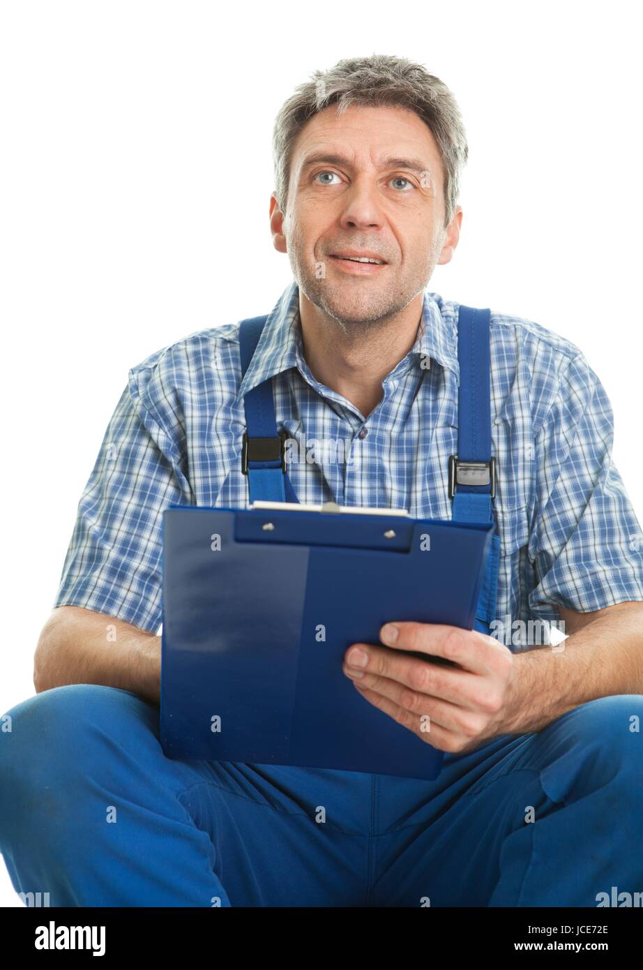 Confident male contractor writing on hi-res stock photography and ...