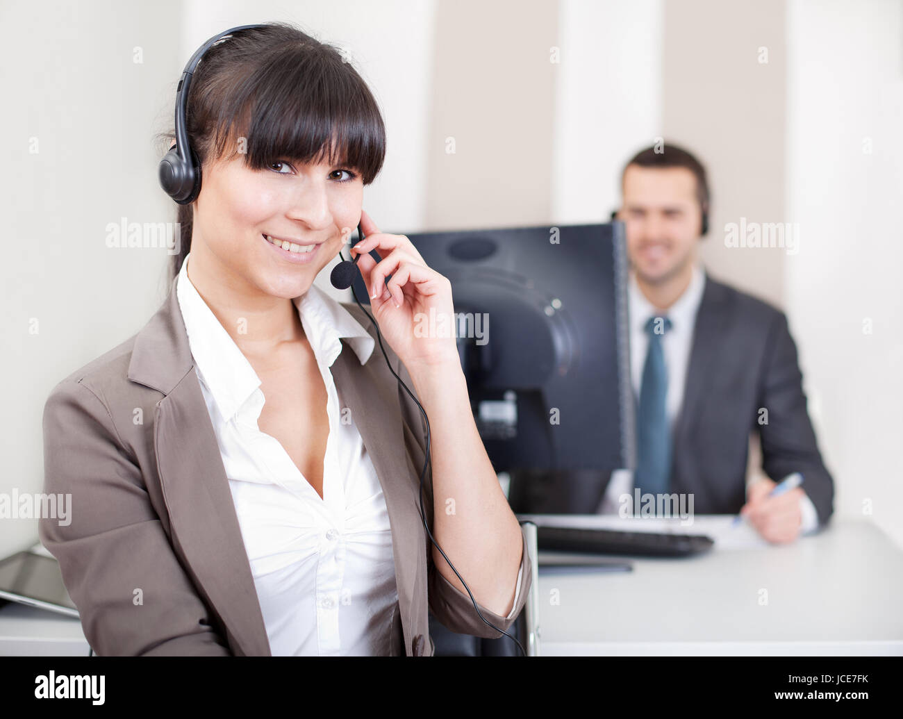 Team of young call center operators on the phone Stock Photo - Alamy