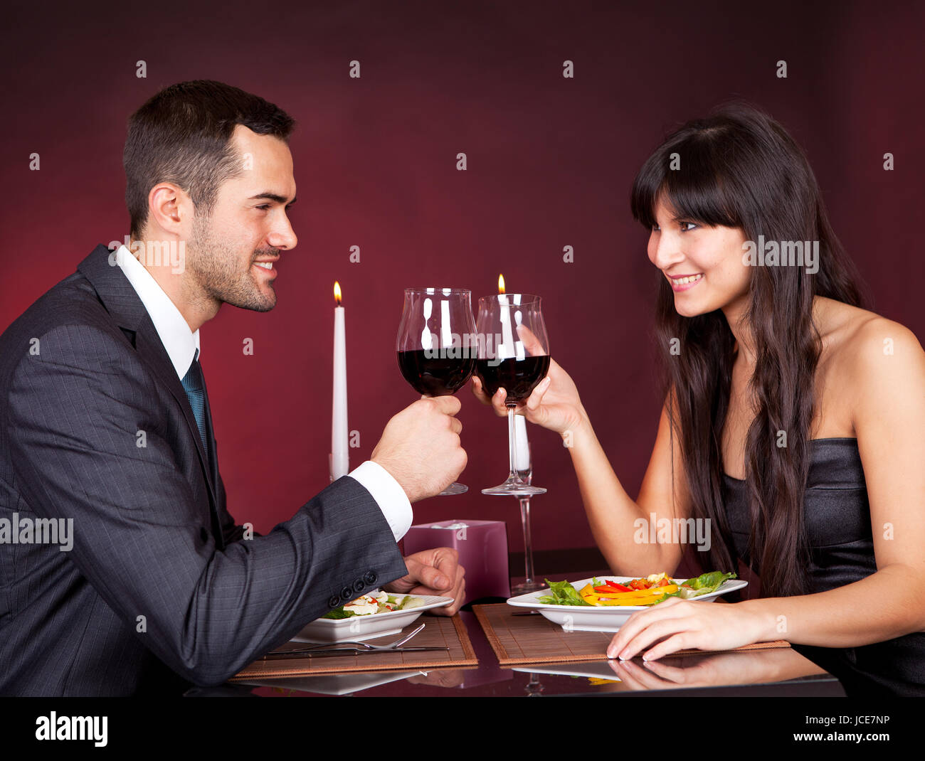 Lovely young couple having romantic dinner in restaurant Stock Photo ...