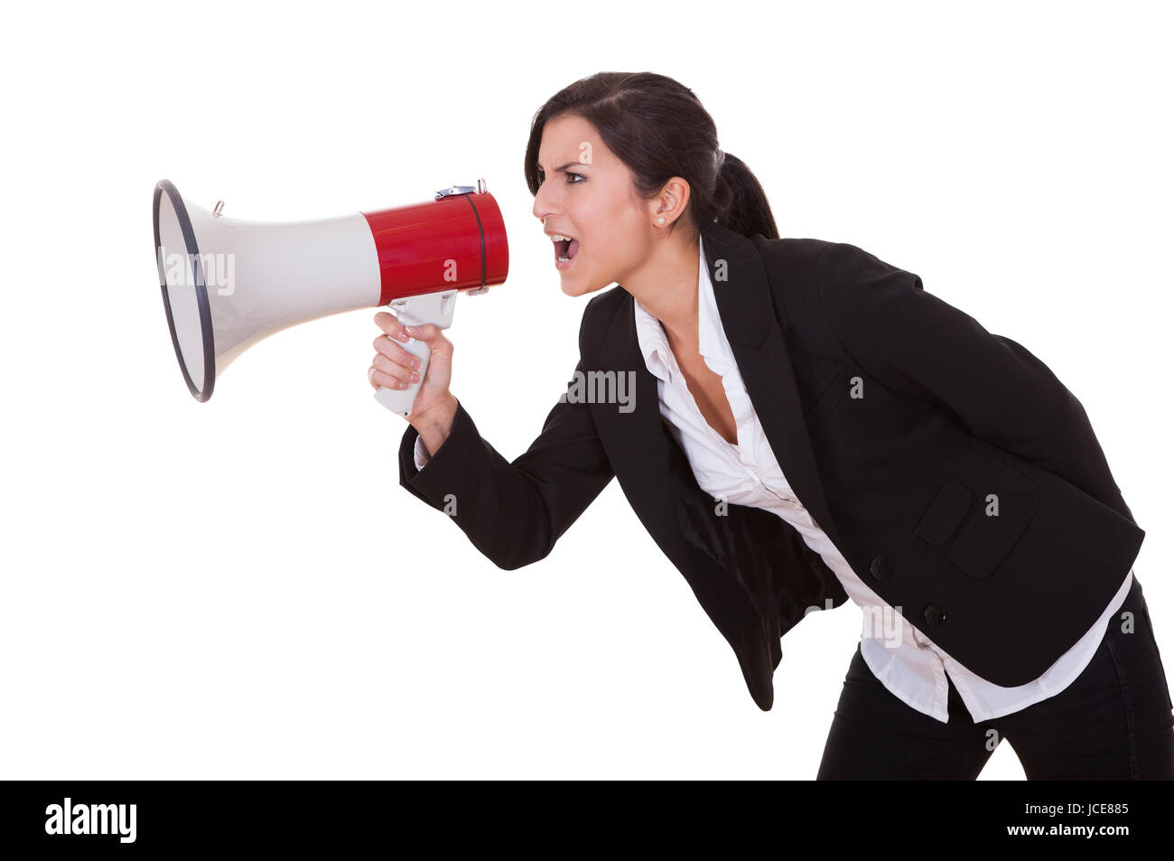 Woman shouts through a megaphone. Studio shot over white Stock Photo ...