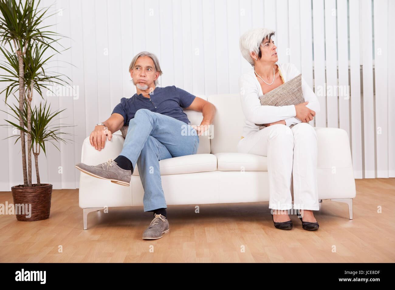 Couple sitting opposite from each other hi-res stock photography and ...