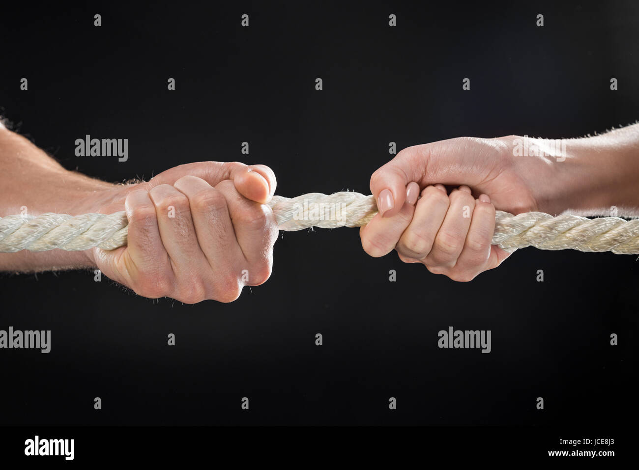 Rope hands pulling together hi-res stock photography and images - Alamy