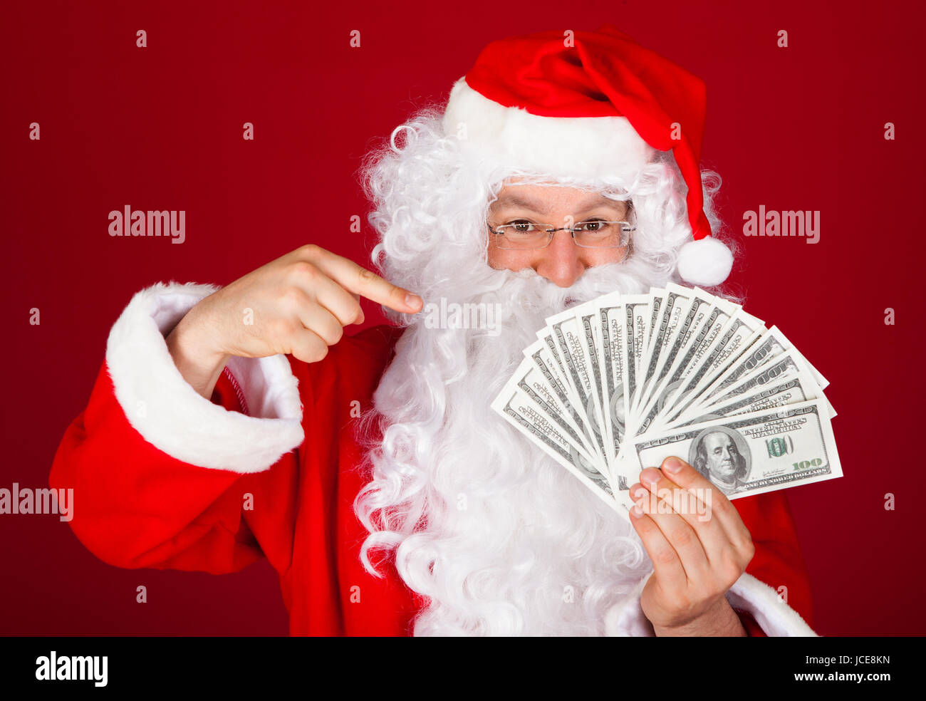 Happy santa claus showing cash hi-res stock photography and images - Alamy