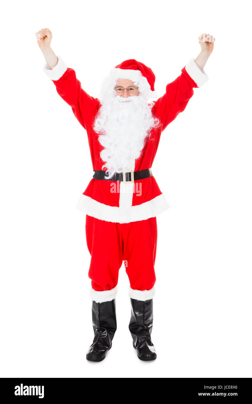 Portrait of excited santa raising his arms on white background Stock ...