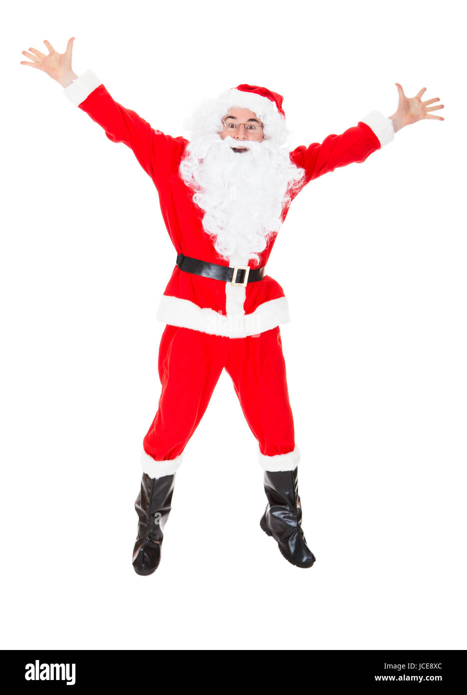 Portrait of excited santa raising his arms on white background Stock ...