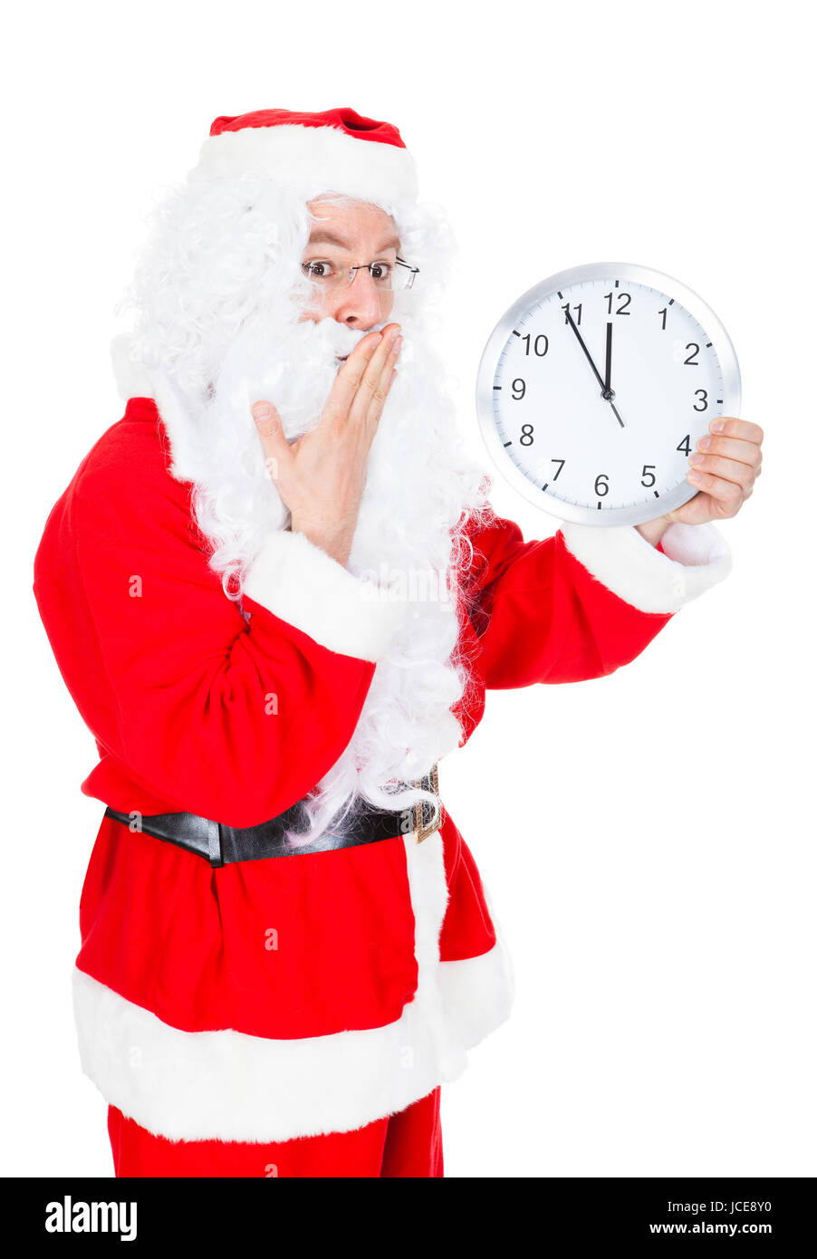 Santa Pointing At Clock Showing Time Over White Background Stock Photo ...